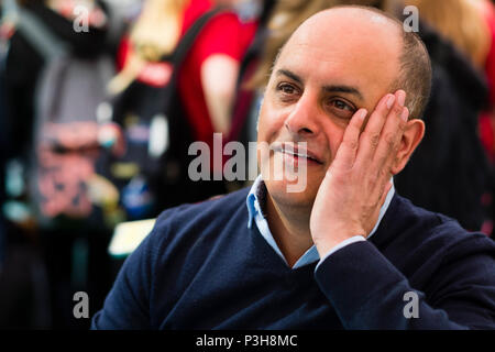 Children's book author Bali Rai talking to a secondary school pupil ...