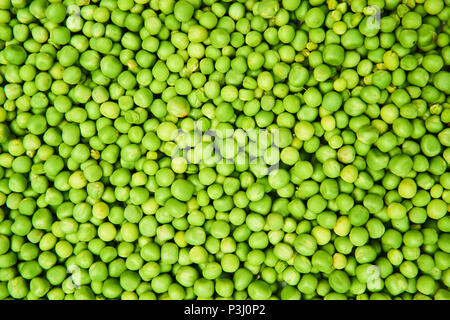 Fresh green peas background texture top view Stock Photo - Alamy