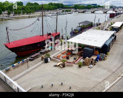 Floating bars and restaurants with outdoor seating areas along the ...