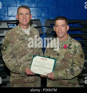 Command Sgt. Maj. Eric B. Olsen, stands in front of a formation of 4th ...