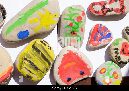 group of pebbles with bright paintings and colors Stock Photo - Alamy