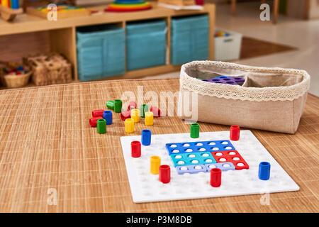Colorful numicon game set with basket full of pieces Stock Photo - Alamy