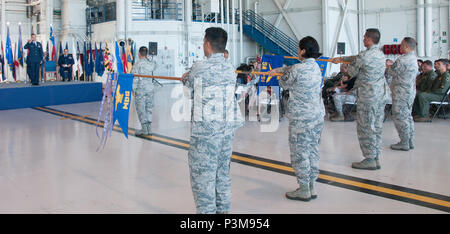 Brig Gen. Gregory S. Woodrow, Commander of the 154th Wing, presents the ...