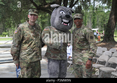 Sgt. Rocky (left), mascot of 3rd Infantry Division, high-fives a ...