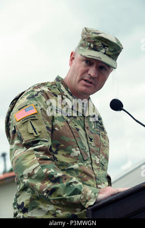U.S. Army Col. Brian Hughes, Joint Task Force – Bravo, shakes hands ...