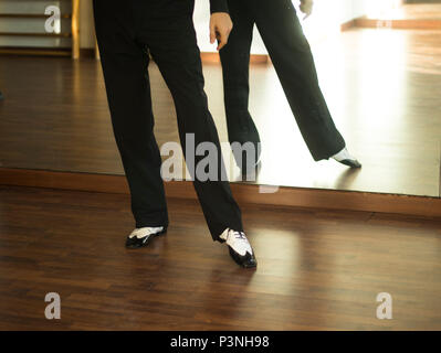 Ballroom dance salsa dancer instructors man and woman couple dancing in ...