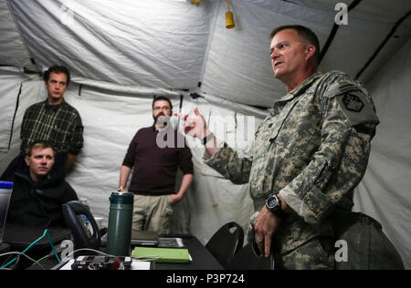 Commander of the 48th Chemical Brigade, Col W.M. Bochat, receives a ...