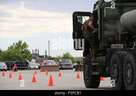 Pfc. Logan Harpine enters the cab of a M970 semitrailer refueler truck ...