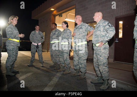 Col. DeAnna Burt, Air Expeditionary Wing commander, receives a briefing from Maj. Brian Cooper ...