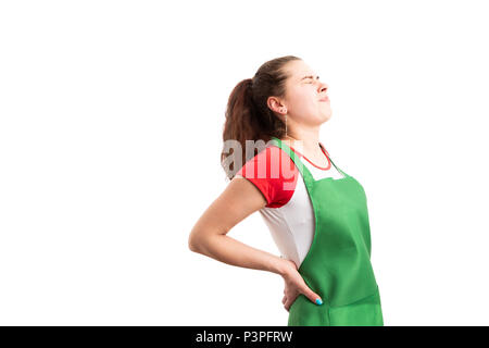 Female storekeeper or supermarket employee pressing painful temples ...