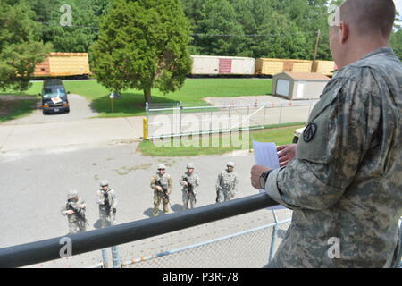 U.S. Soldiers receive instructions before commencing the 9mm pistol ...