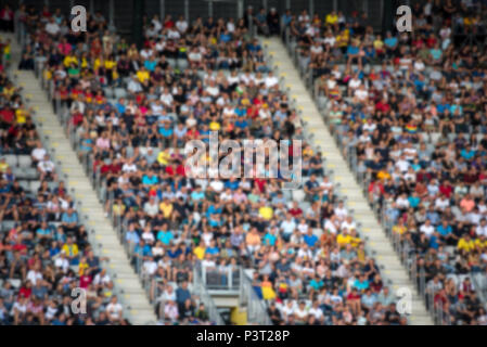 Tribune of the stadium. Crowded stands. Spectators in the open stadium ...