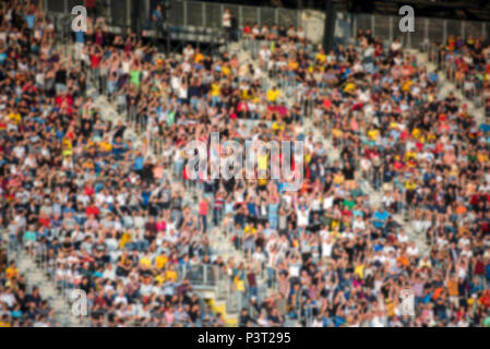 Tribune of the stadium. Crowded stands. Spectators in the open stadium ...