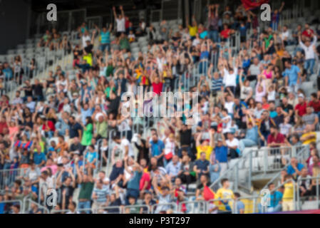 Tribune of the stadium. Crowded stands. Spectators in the open stadium ...