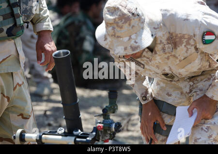 U.S. Army Soldiers aim and fire a 120mm M120A1 Towed Mortar System ...