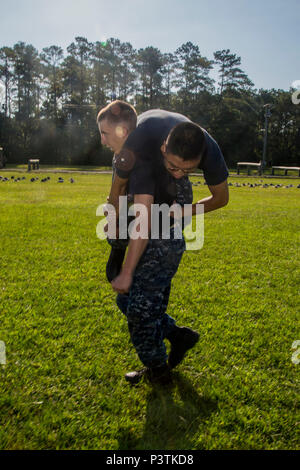 U.S. Marine Corps ROTC carry flags during a Veteran's Day parade Friday ...