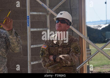 Col. Robey Brantley (Center), officer in charge of Operation Resolute ...