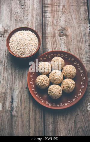 Amaranth or rajgira lahi in a bowl with sweet laddu. selective focus ...