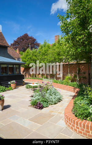 Overview of garden patio with Pyrus calleryana 'Chanticleer' screening ...