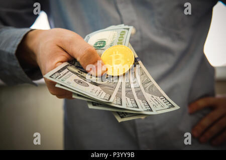Golden bitcoin coin in man's hand, Myanmar flag in the background Stock ...