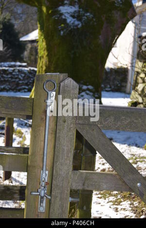 Wooden post with gate latch on a public footpath through a field Stock ...