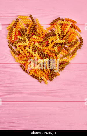 Valentines Day decoration from fusilli macaroni. Heart from spiral ...