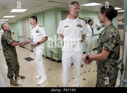 US Navy Commander U.S. Pacific Command, Adm. William Fallon, talks with ...
