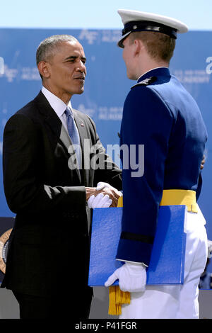 President Barack Obama congratulates a graduate during the U.S. Naval ...