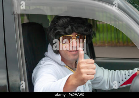 Hackney taxi cab driver giving directions to a pedestrian in the city ...