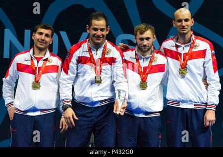The Men's Epee fencing team of France, display their gold medals as ...