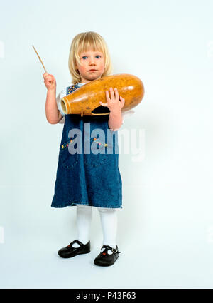 Guiro with its scraper - percussion instrument White background Stock ...
