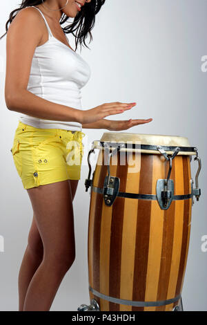 Brazilian girl playing congas Stock Photo - Alamy