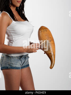 Cuban salsa musician playing a guiro (Latin American percussion ...