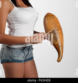 Cuban salsa musician playing a guiro (Latin American percussion ...
