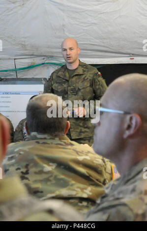 Maj. Gen. Gregory J. Mosser, center, deputy commanding general, U.S ...