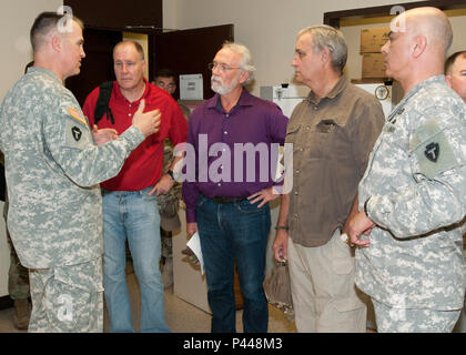 Lt. Gen. Mike Hood, commander of the Royal Canadian Air Force, seated ...