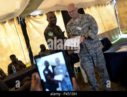 Maj. Michael McGourty, 102nd Medical Group medical provider, evaluates ...