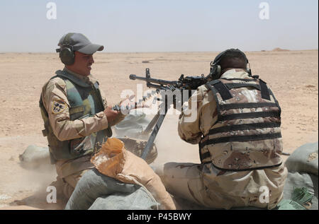An Iraqi soldier assigned to the 2nd Anbar Battalion fires a DShK heavy ...