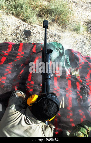 Iraqi soldiers fire a .50-caliber machine gun during the heavy weapons ...