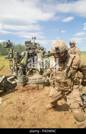 Members of a field artillery battery with their 155mm gun cleverly ...