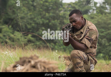 A Gabonese Armed Forces soldier during a simulated combat exercise at ...