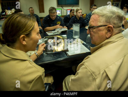 U.S. Navy Cmdr. Amy McInnis poses for a photo with (from left) Vietnam ...