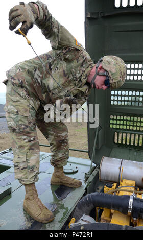 A horizontal construction engineer with the 186th Engineer Company ...