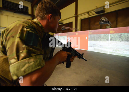 A British soldier trains his marksmanship skills at the Training ...