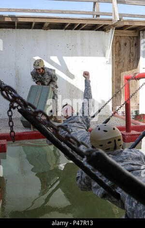 Army platoon crosses water obstacle during exercise Stock Photo - Alamy