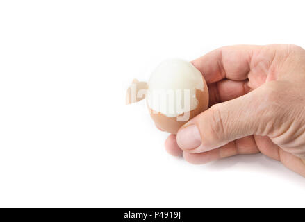 Peeling off the hard egg shell with hands on the white Stock Photo - Alamy