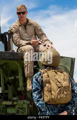 A Marine gunner on the tube-launched optically-tracked, wire-guided ...