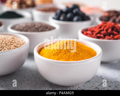 Various healthy superfoods powder in bowls Stock Photo - Alamy