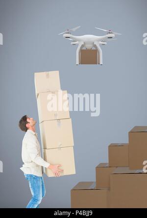 Delivery man standing with parcels Stock Photo - Alamy