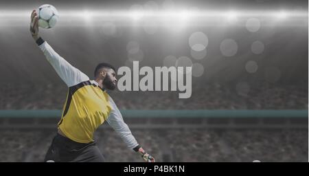 Soccer goalkeeper throwing ball in stadium with transition Stock Photo ...
